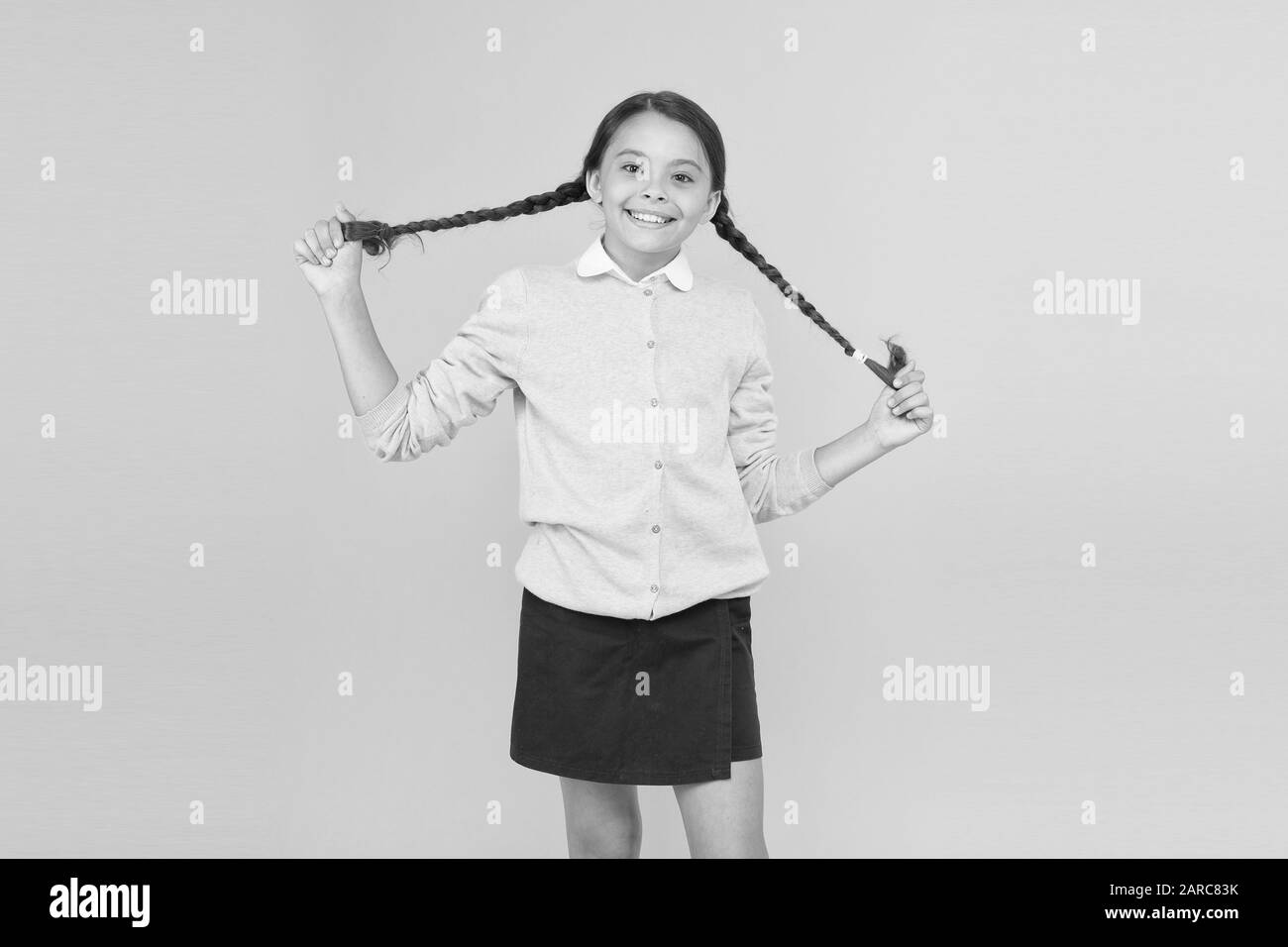 happy look. smart little girl on yellow background. knowledge day ...