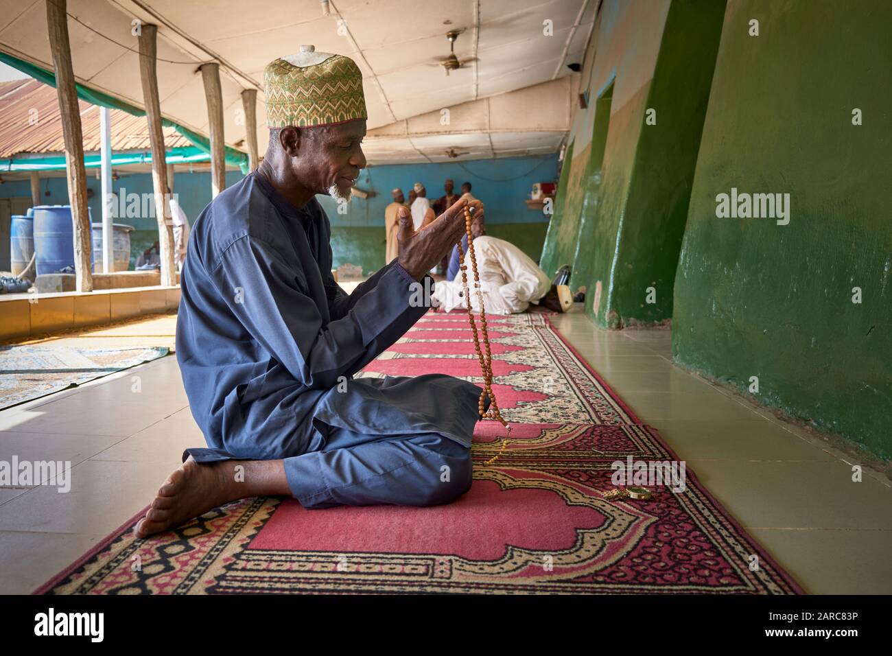 Muslim man praying in a mosque Stock Photo - Alamy