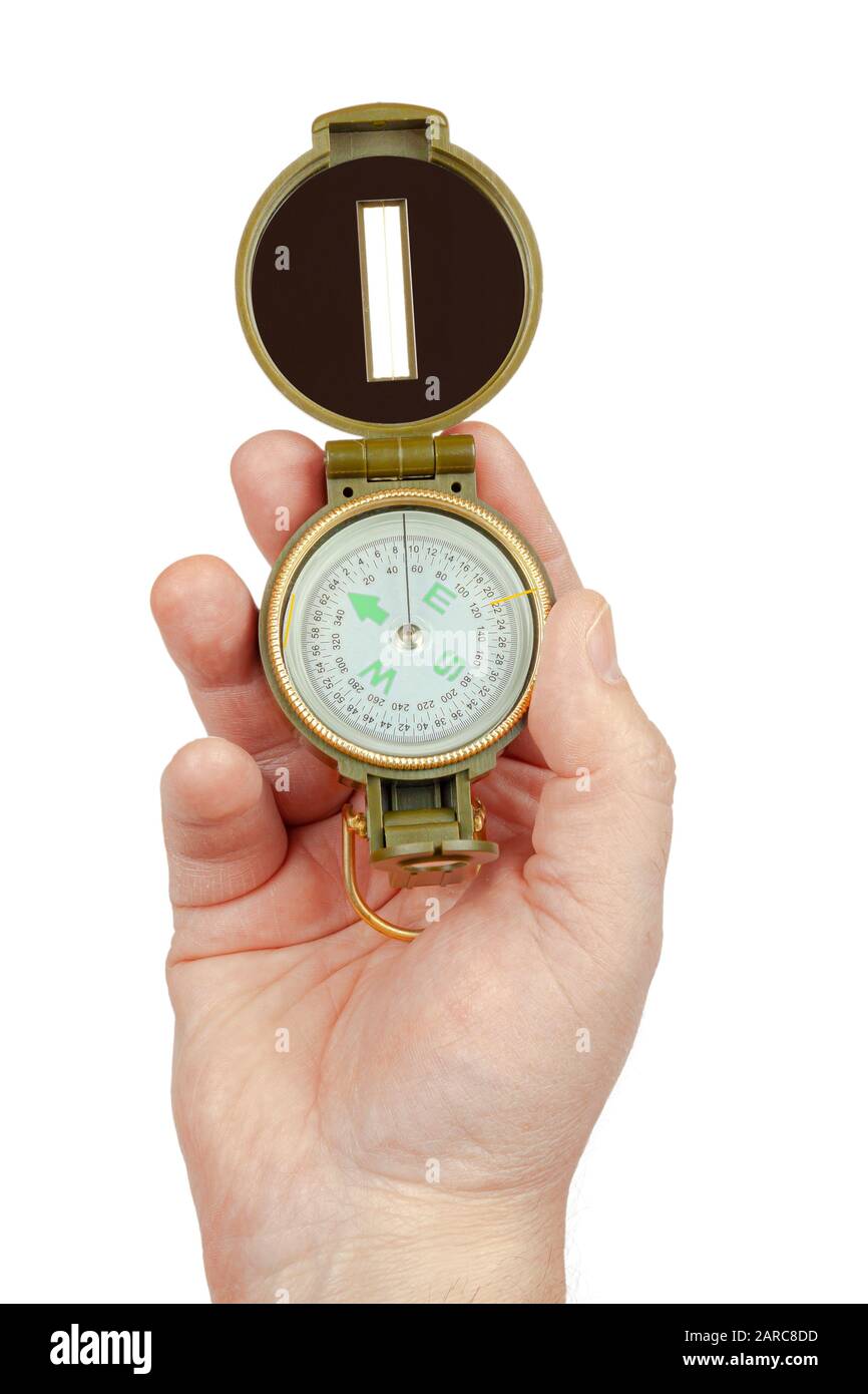 The hand holds the compass on a white background, isolate Stock Photo ...