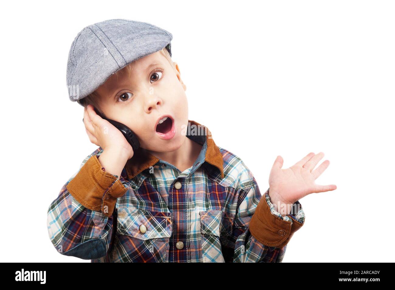 boy in a cap on the phone isolated on white background Stock Photo - Alamy