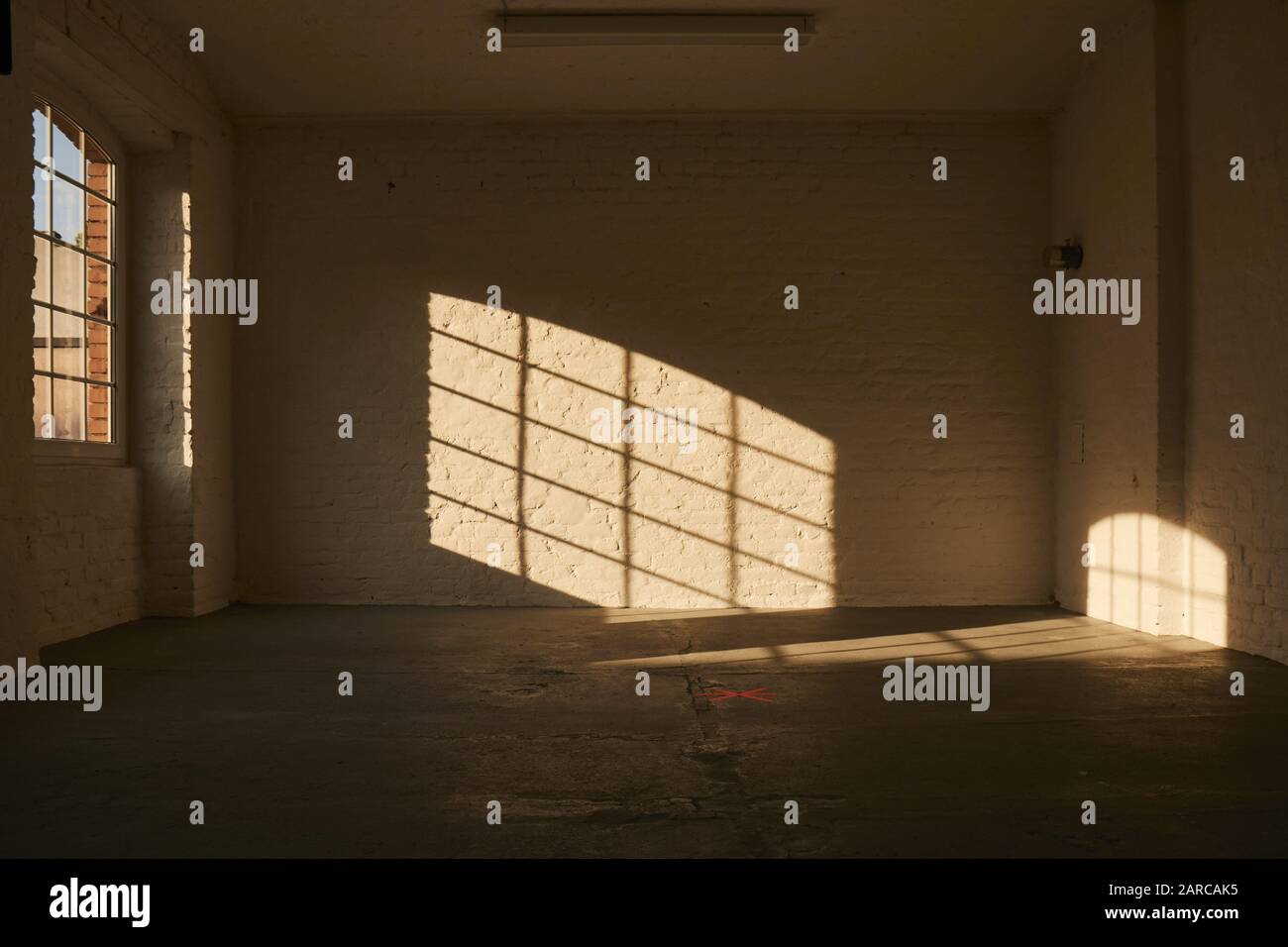 Interior shot of an empty room with white walls Stock Photo - Alamy