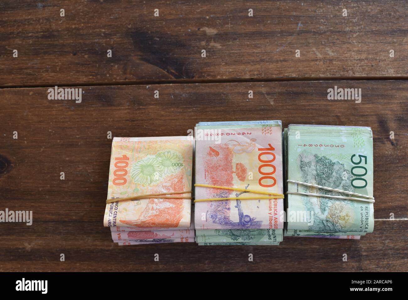 stacks of Argentine peso bills of 500 and 1000 pesos Stock Photo - Alamy