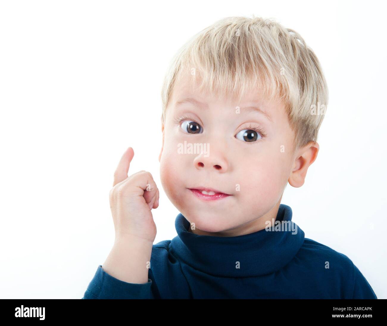 Cute boy in a questioning look on his face on a white background Stock ...