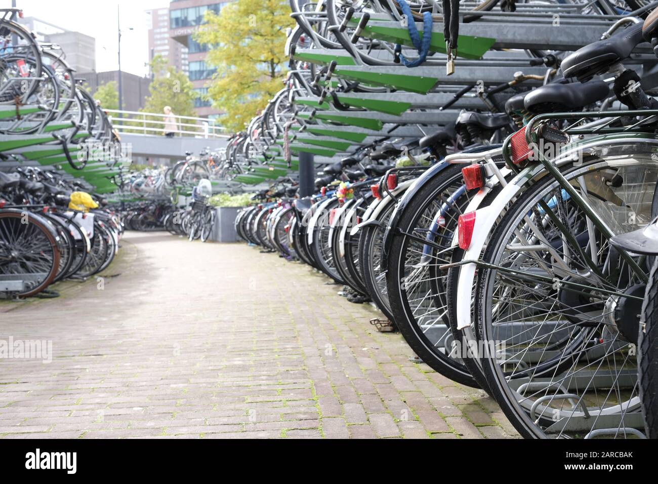 Long shot of bicycle parking area in a city Stock Photo - Alamy