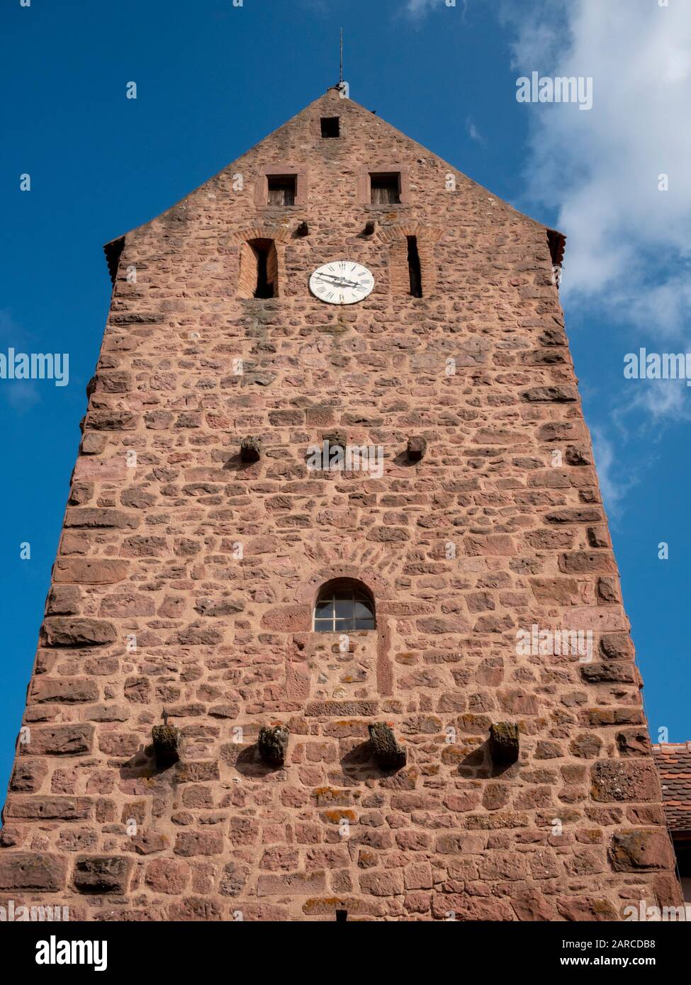 An old stone clock tower in Riquewihr Alsace France Stock Photo - Alamy