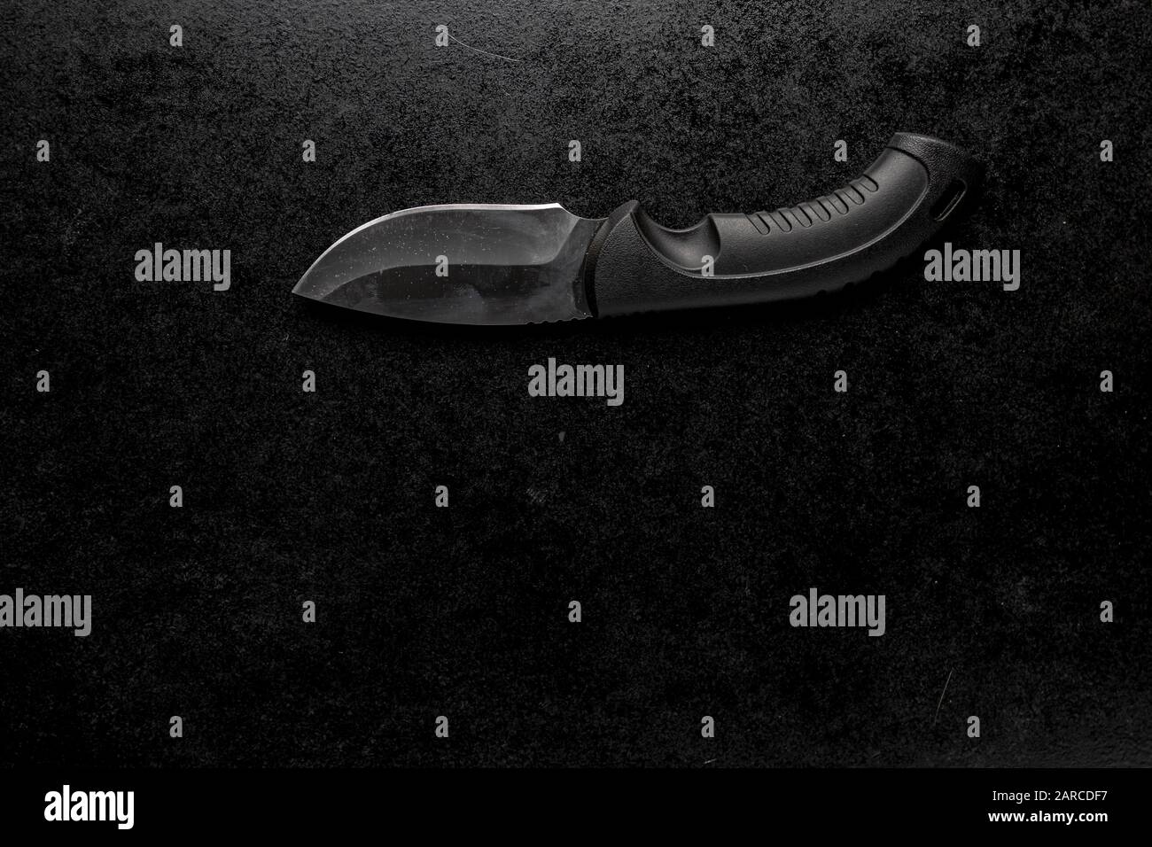 Black sharp small knife with black handle Stock Photo - Alamy