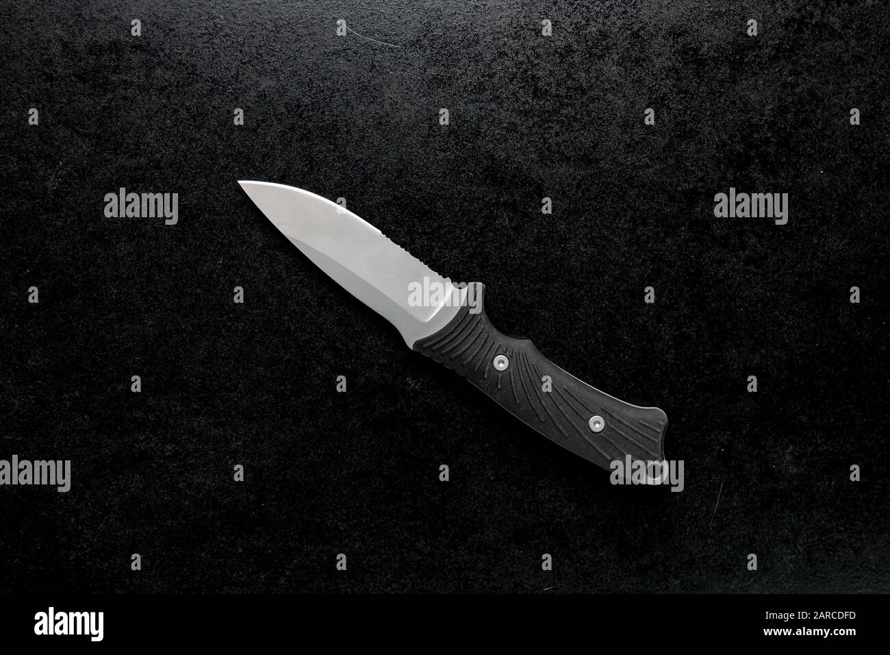 Black sharp small knife with black handle Stock Photo - Alamy
