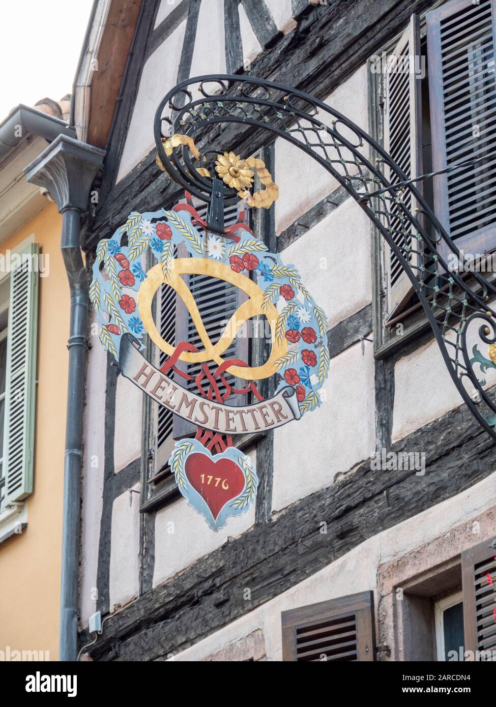 A traditional alsation wrought iron sign for the bakery Helmstetter in ...