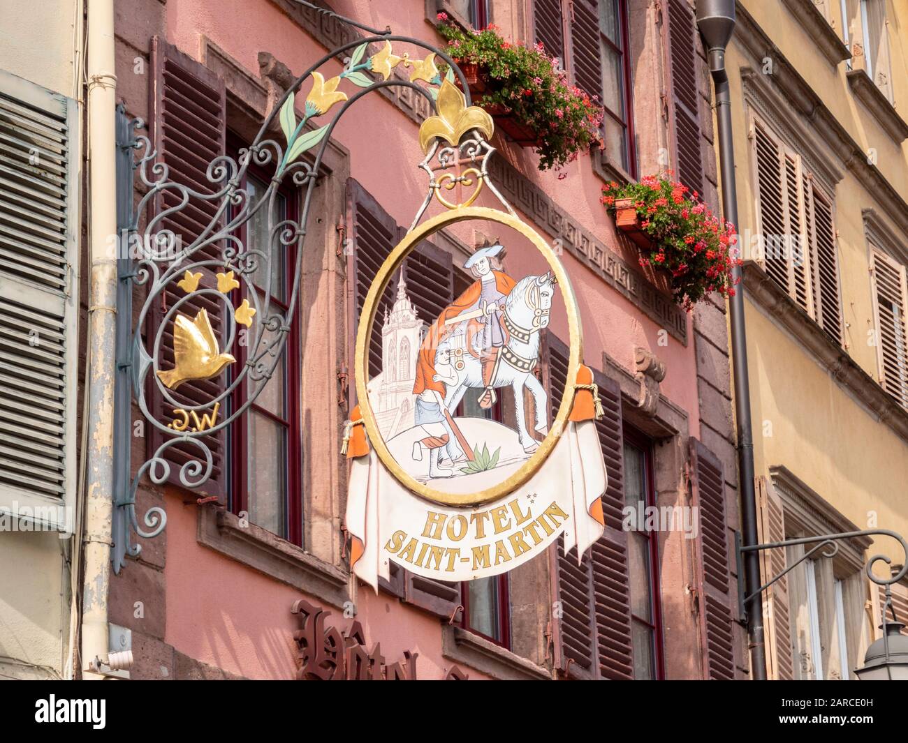The traditional wrought iron sign at the Hotel Saint Martin in Colmar ...