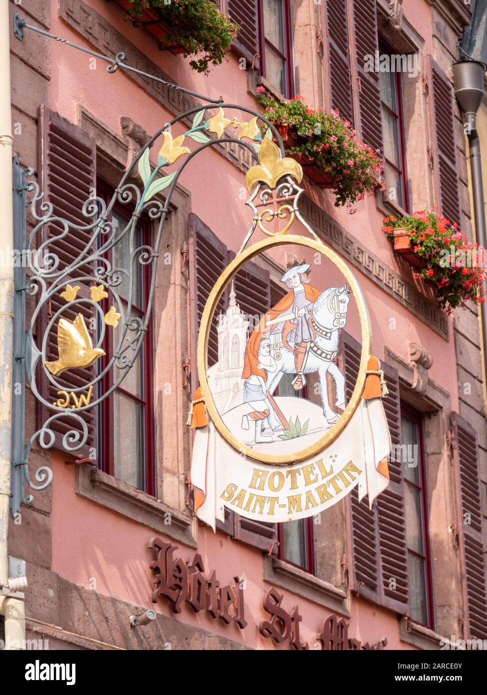 The traditional wrought iron sign at the Hotel Saint Martin in Colmar ...