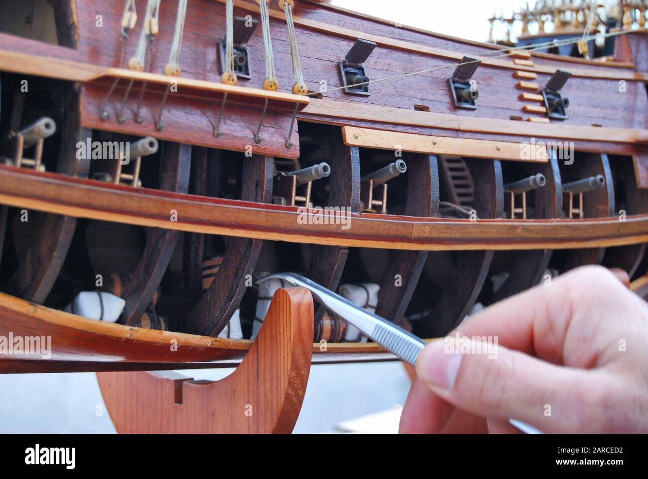Young man constructing a ship model in a ship-modelling studio Stock ...