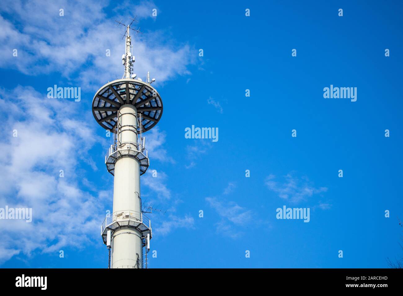 Communication tower on the left side of the picture with a cloudy sky ...