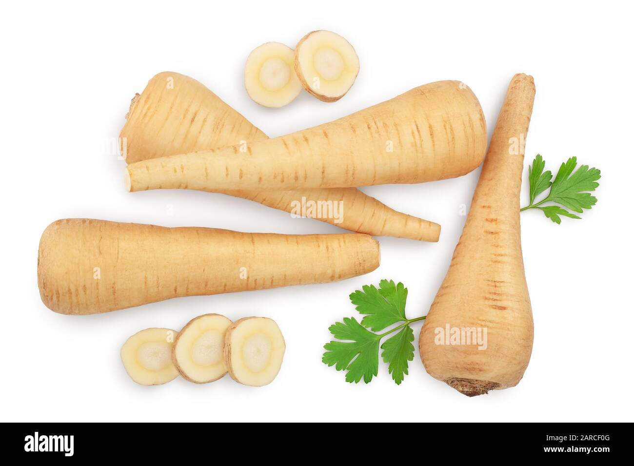 Parsnip root and slices with parsley isolated on white background with ...