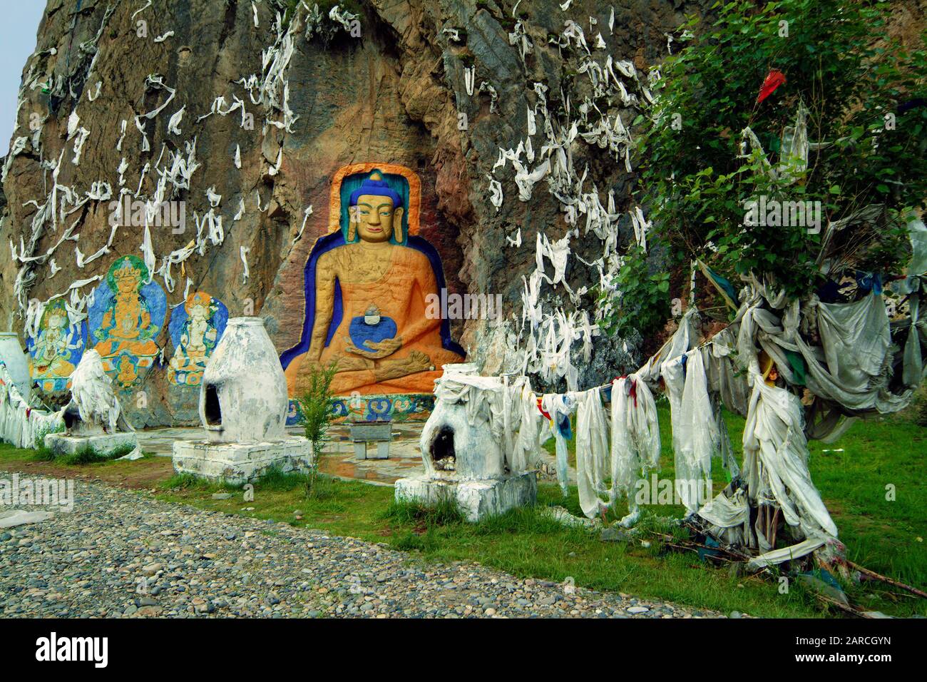 China, shrine with goddess bult into rock face in Tibet Stock Photo - Alamy