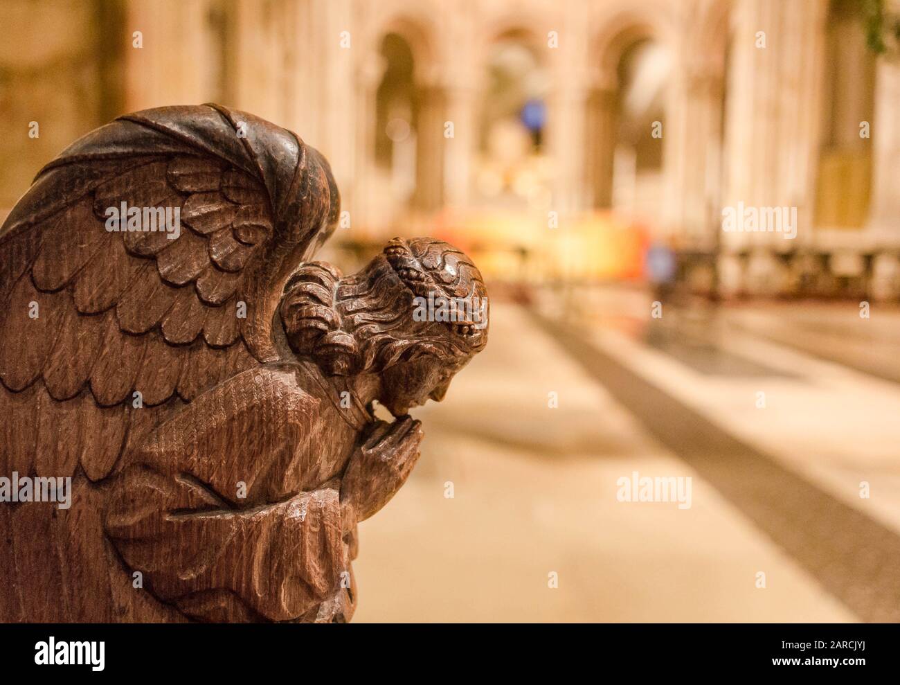 Close Up Shot of Wooden Angle Figure Praying Inside Norwich Cathedral ...