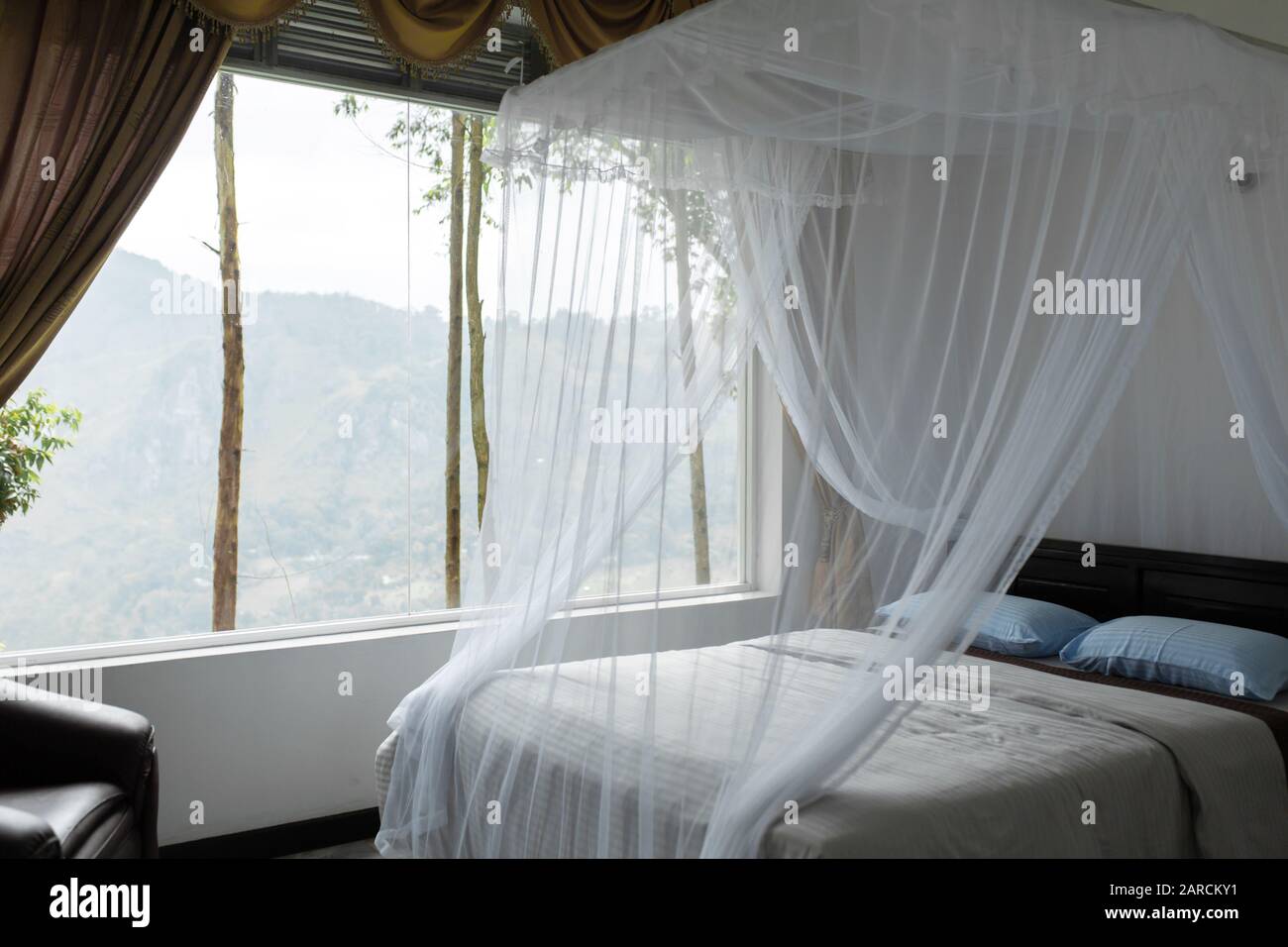 Hotel interior with large panoramic window and view of Mount Stock ...