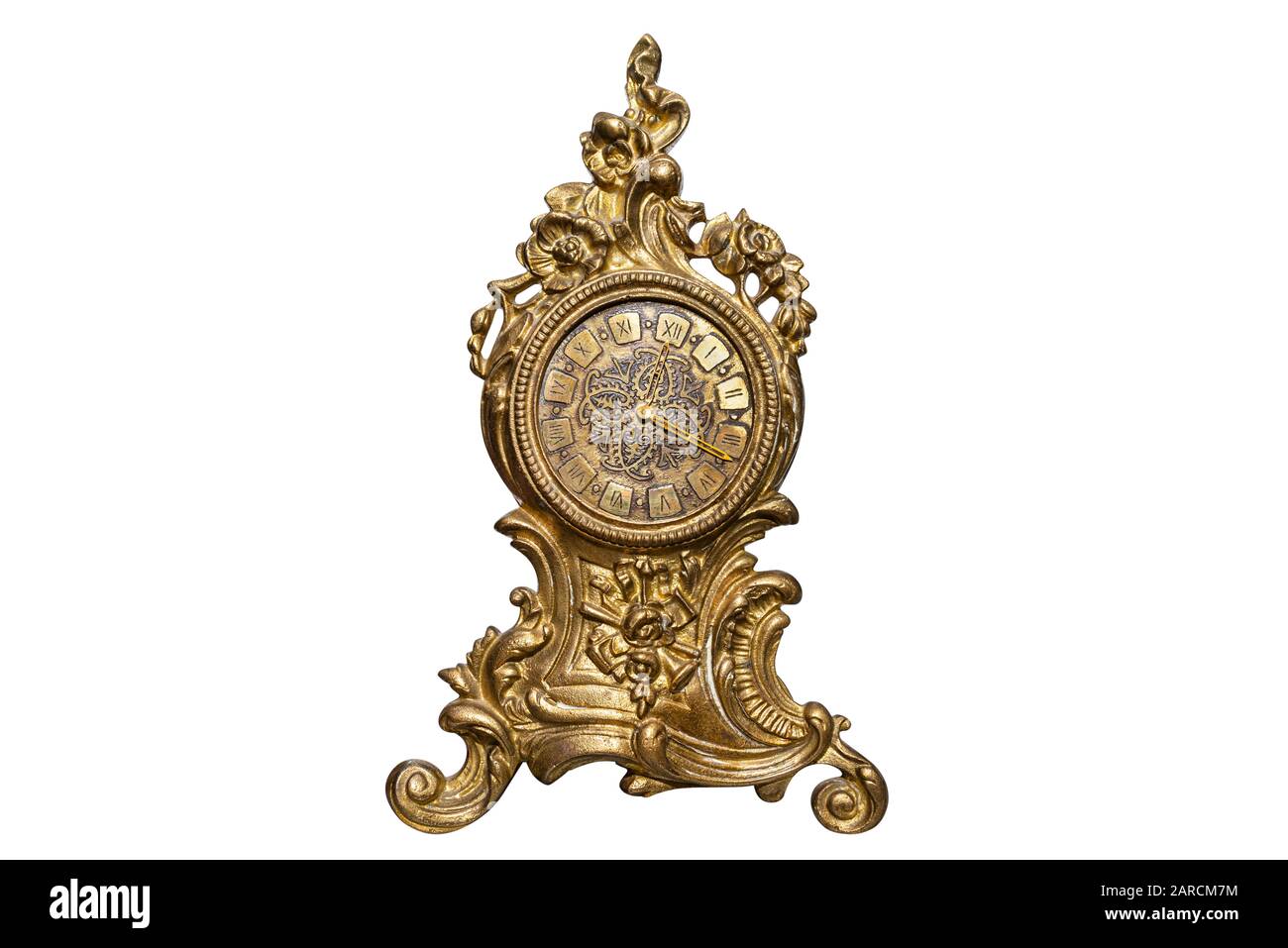 A large, standing clock made of brass with ornaments, isolated on a ...