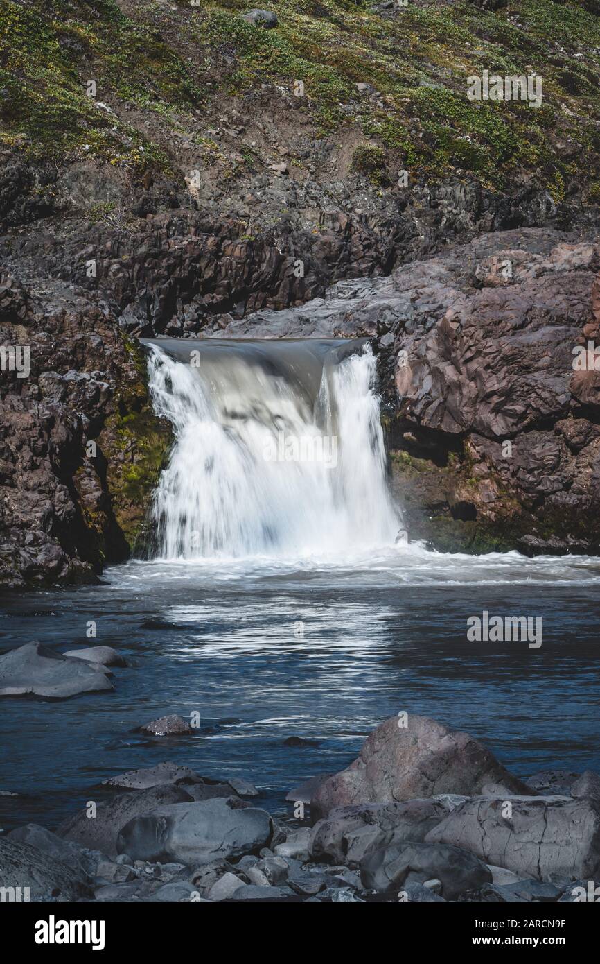 Closeup of a waterfall in a rocky environment on Island of kuannit ...