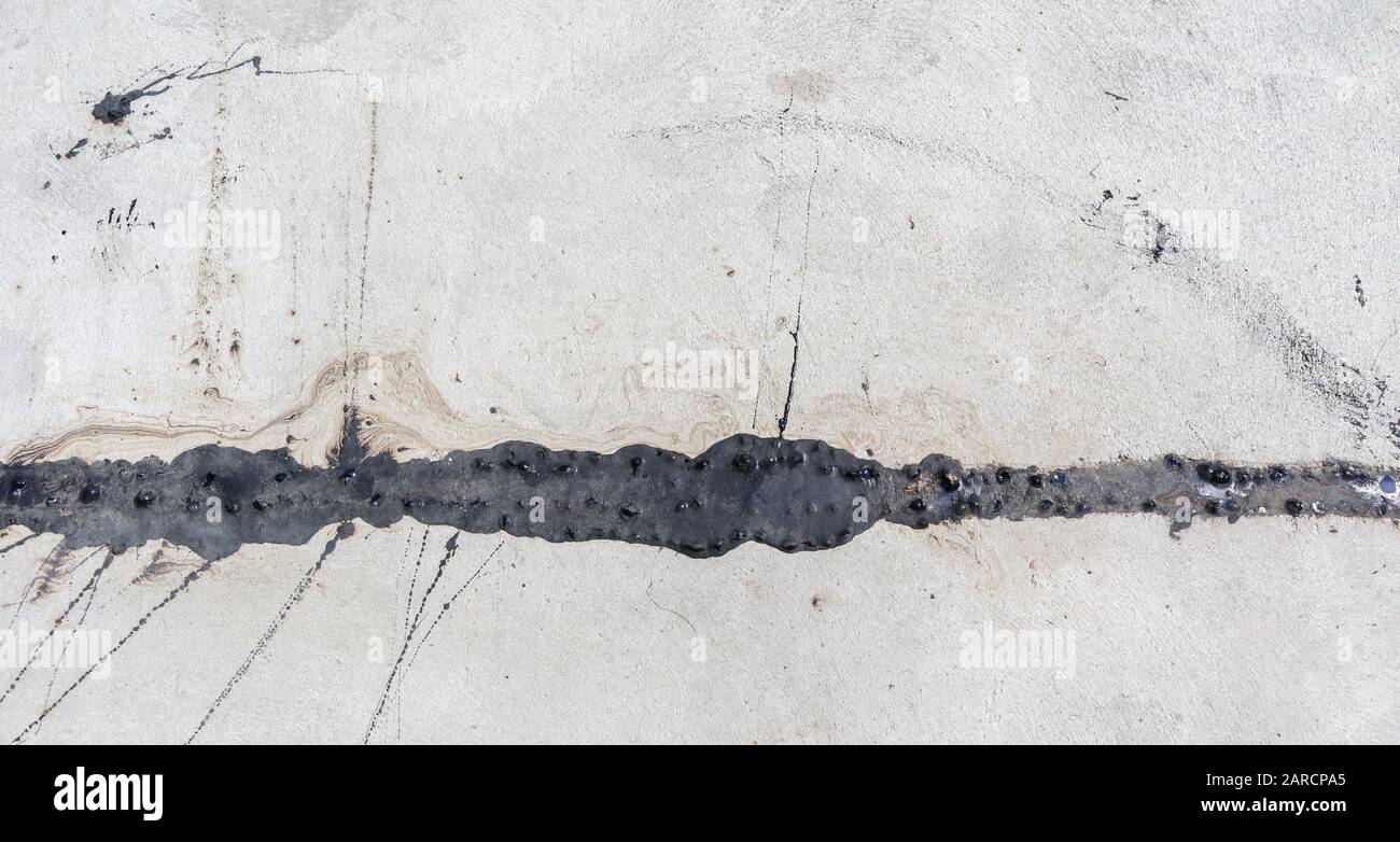 Asphalt in the groove on the concrete road With straight lines Stock ...