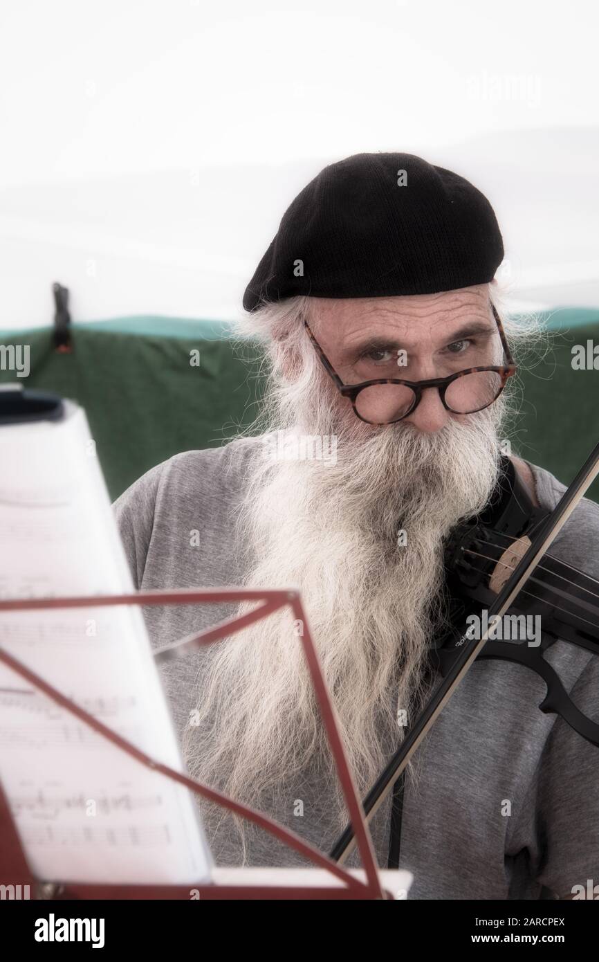 Bearded man playing violin hi-res stock photography and images - Alamy
