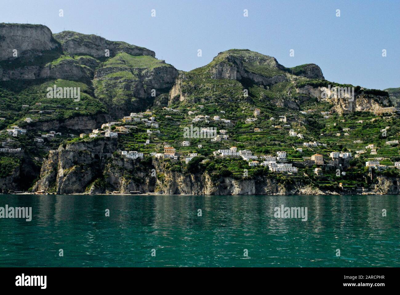 Steep terraced vineyards and white houses on the cliff sides of the ...