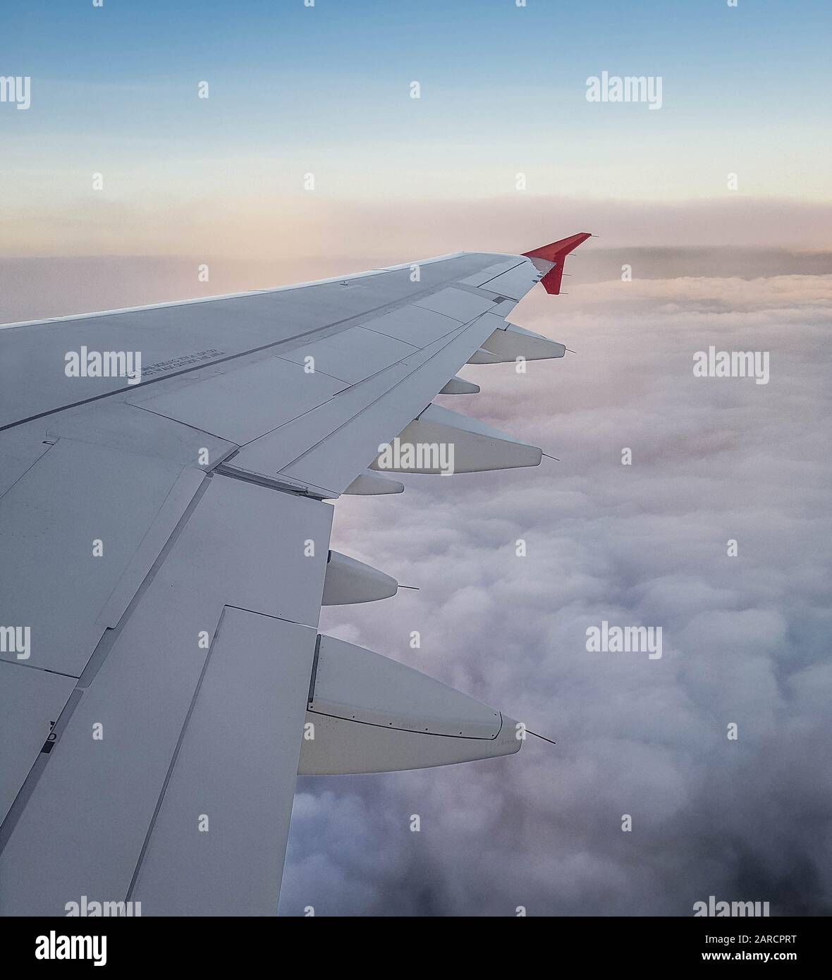 Commercial Airplane Wing Shot Flying Over Beautiful Sunrise Stock Photo ...