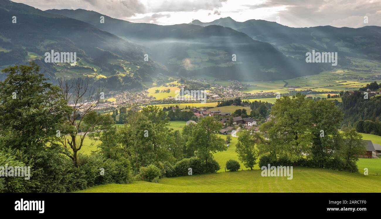 Panorama of a mountain landscape in the Alps with beams of sunlight ...