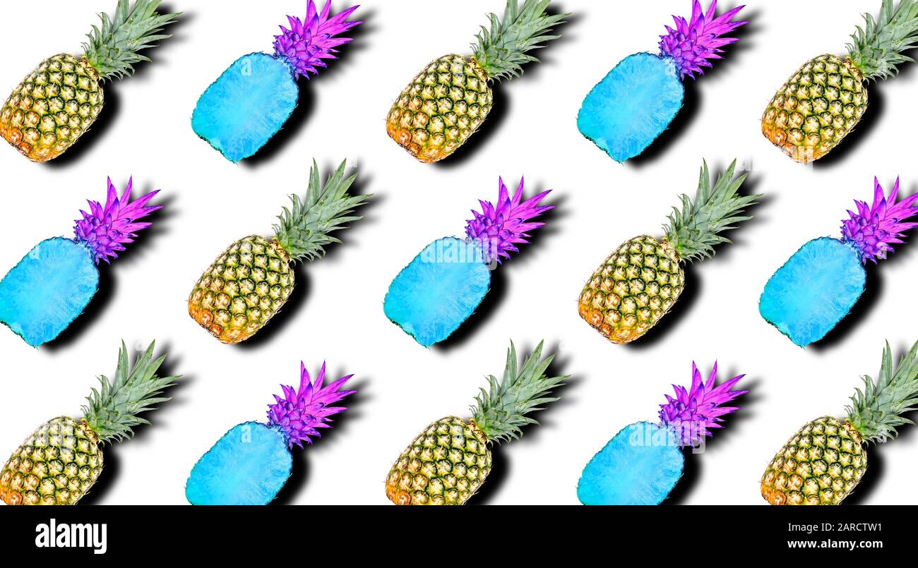 Creative pattern of colorful whole and slice fruit pineapples with ...