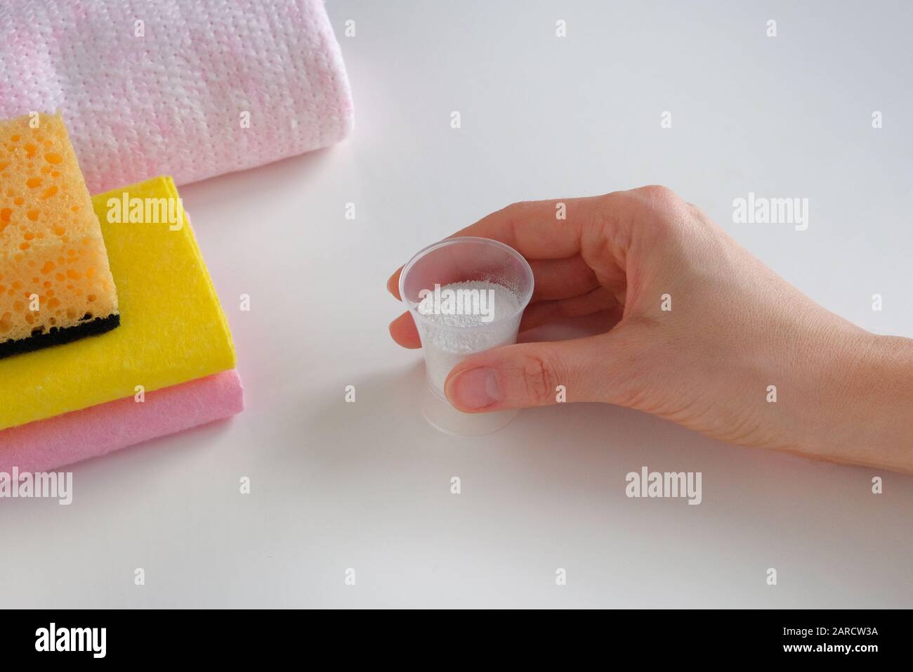 Cleaning concept. Detergent for cleaning room. Hand holding a plastic ...