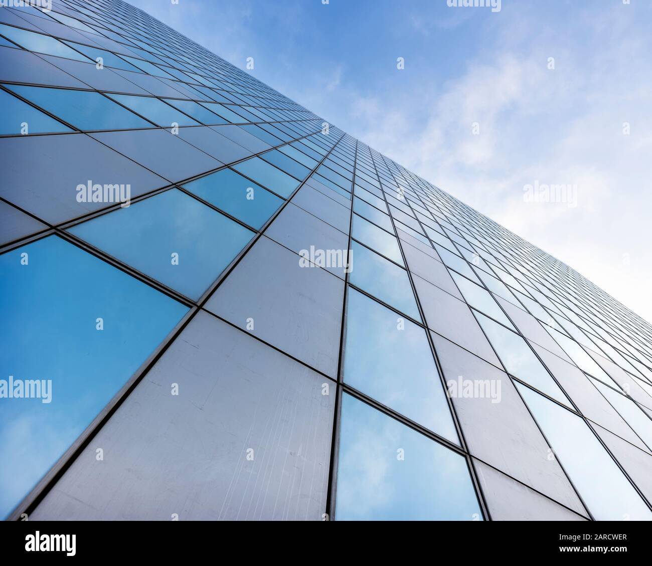 glass facades of modern office buildings and reflection of blue sky ...
