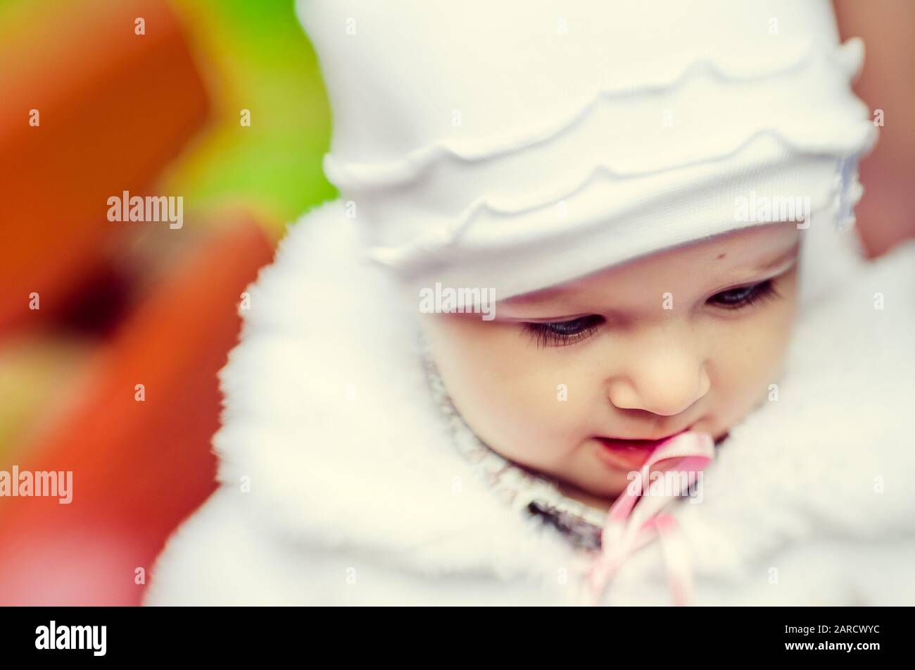 Adorable little girl with roses in hair outdoors Stock Photo - Alamy