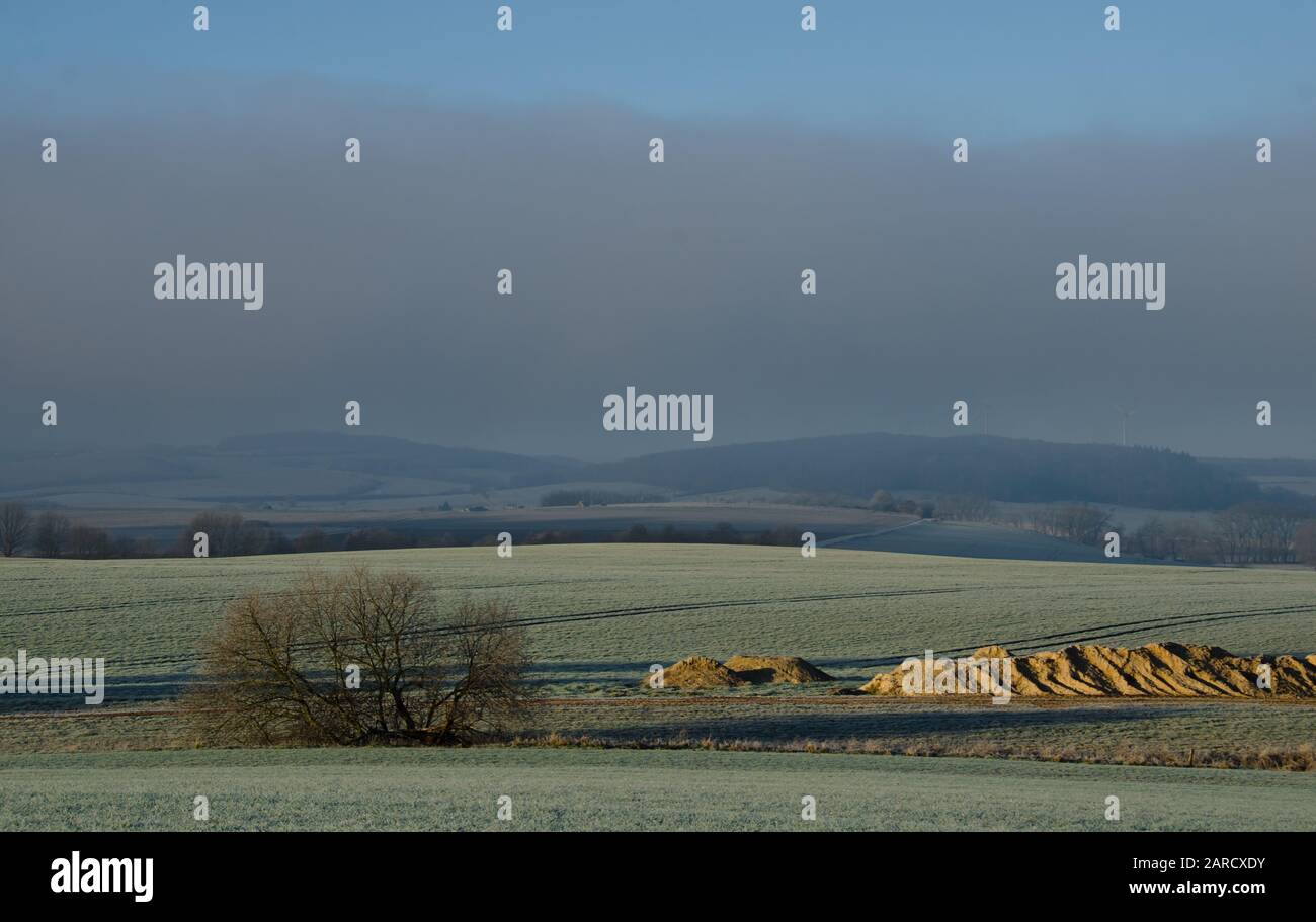 European landscape in winter with fog and snow and ice Stock Photo - Alamy