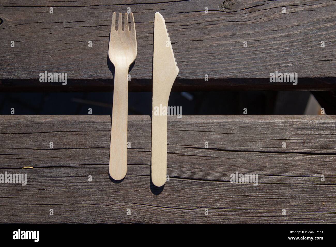 wooden cutlery on a table Stock Photo - Alamy