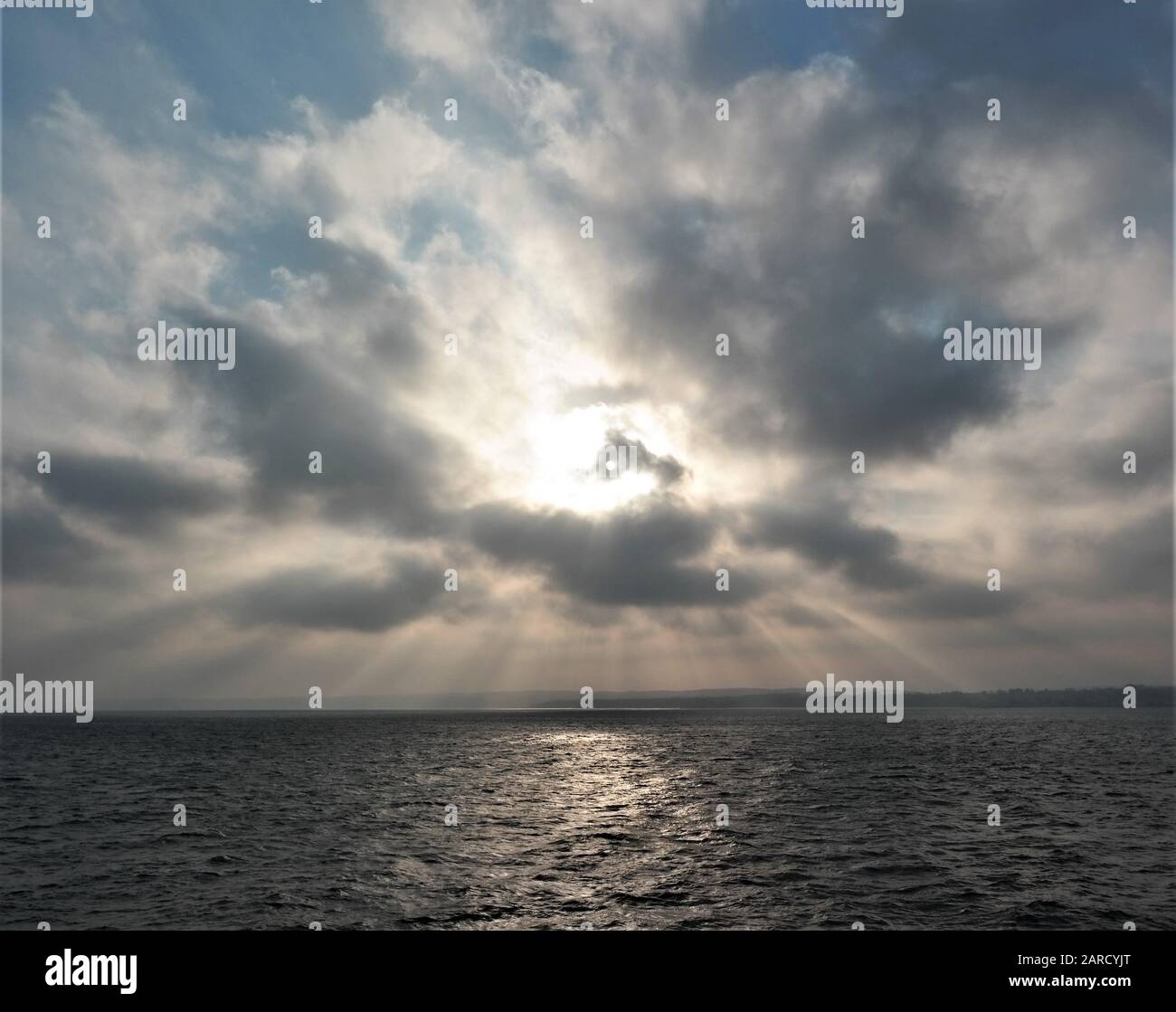 sun rays coming through the clouds Stock Photo - Alamy