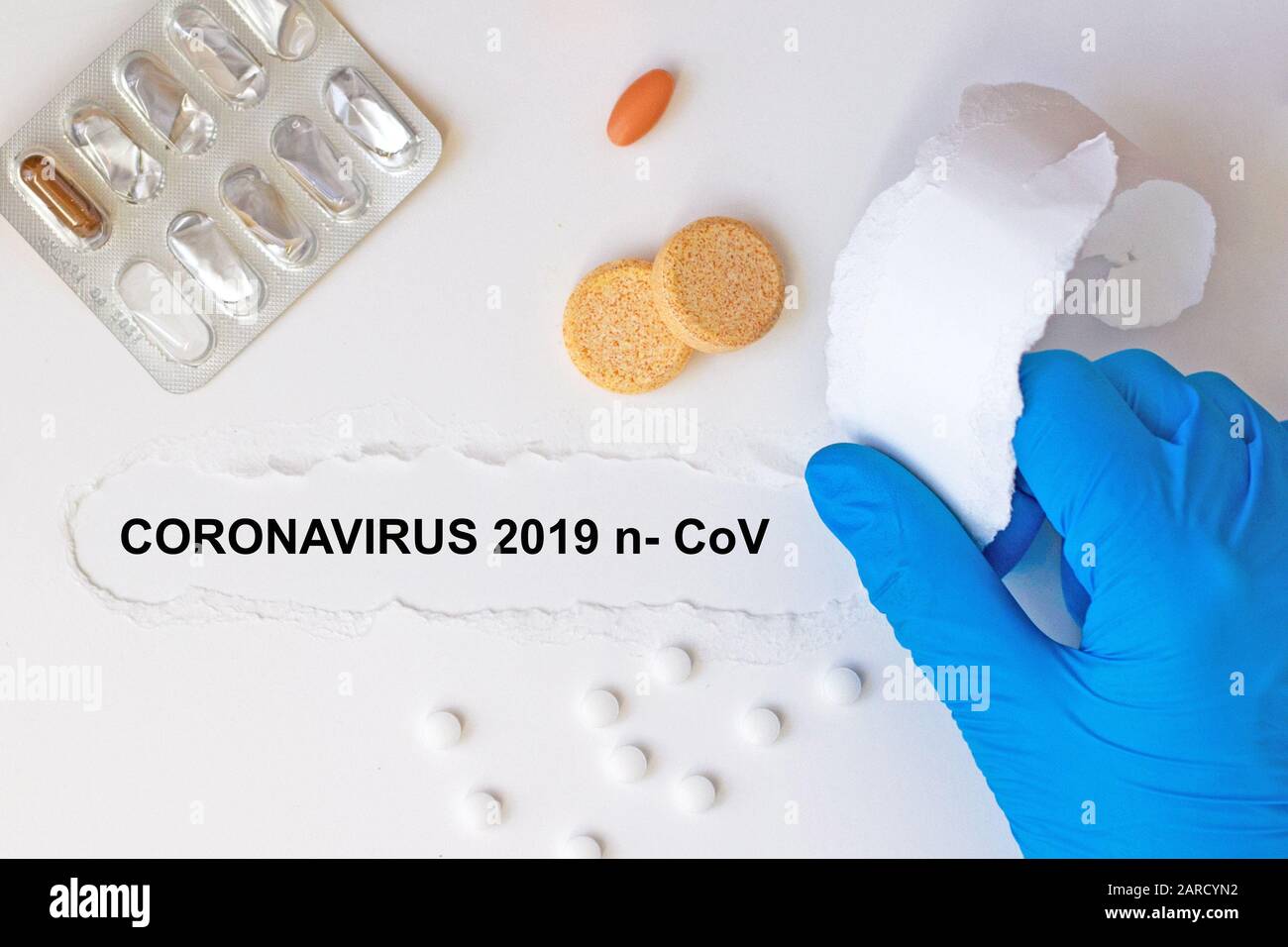 disease epidemic New coronavirus 2019-nCoV. Tablets and a hand in a ...