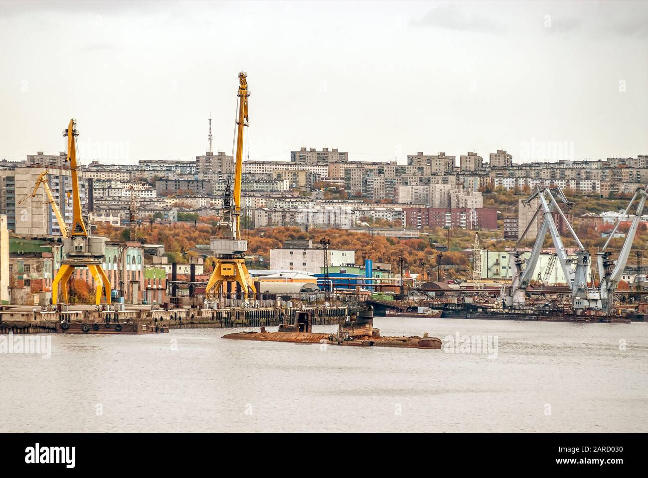 Rusty submarines and old ship in a shipyard in the harbour of Murmansk ...
