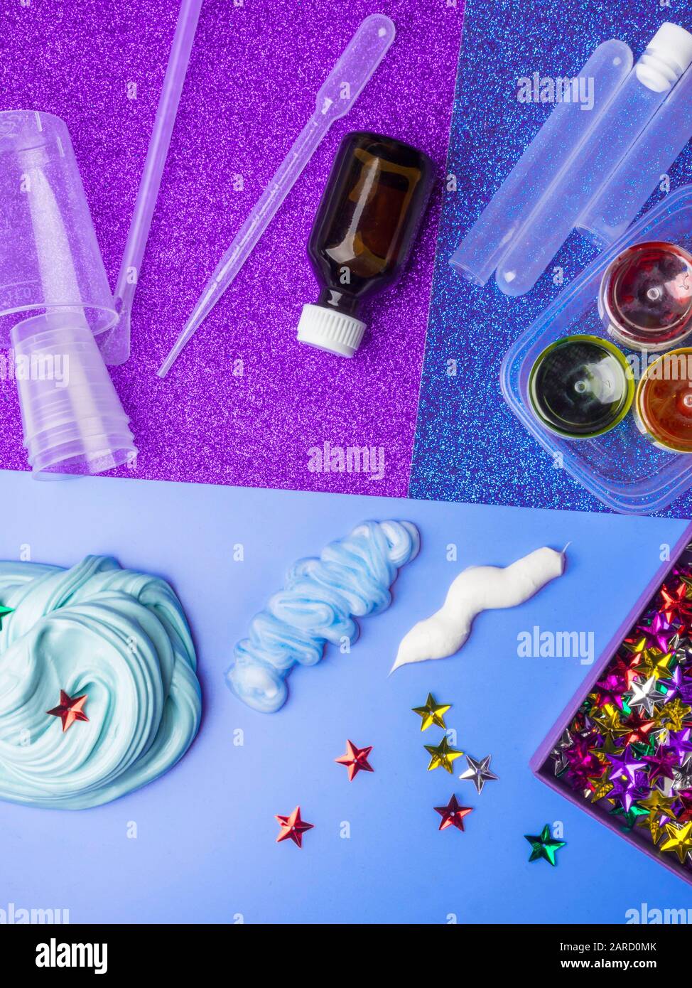 Components to make slime. Child education concept. On blue surface ...