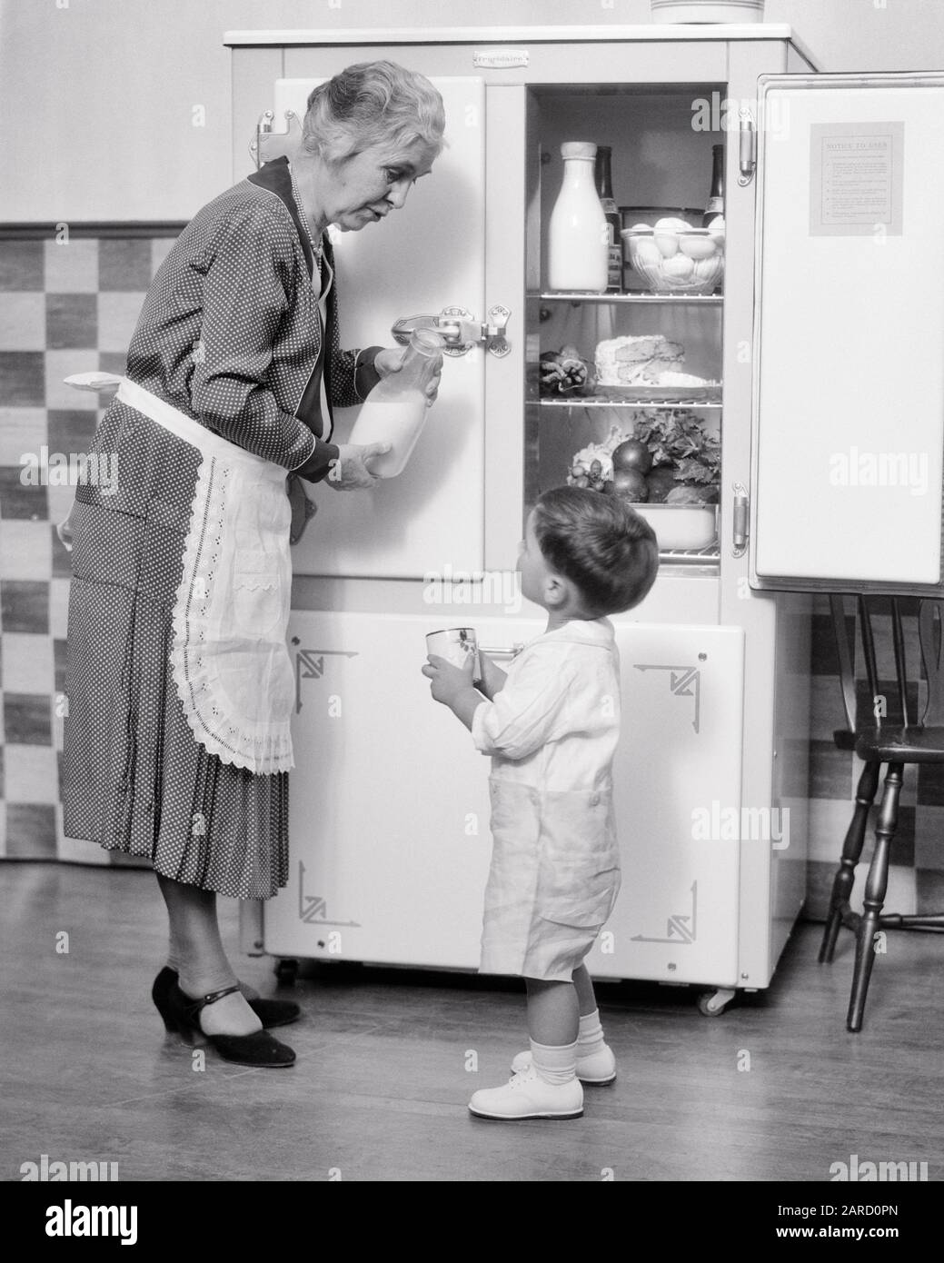 Old lady with child in kitchen hi-res stock photography and images - Alamy