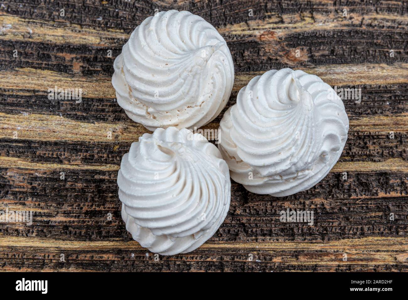 White, whipped, gray and pink swirl meringue cake named Pavlova in the ...