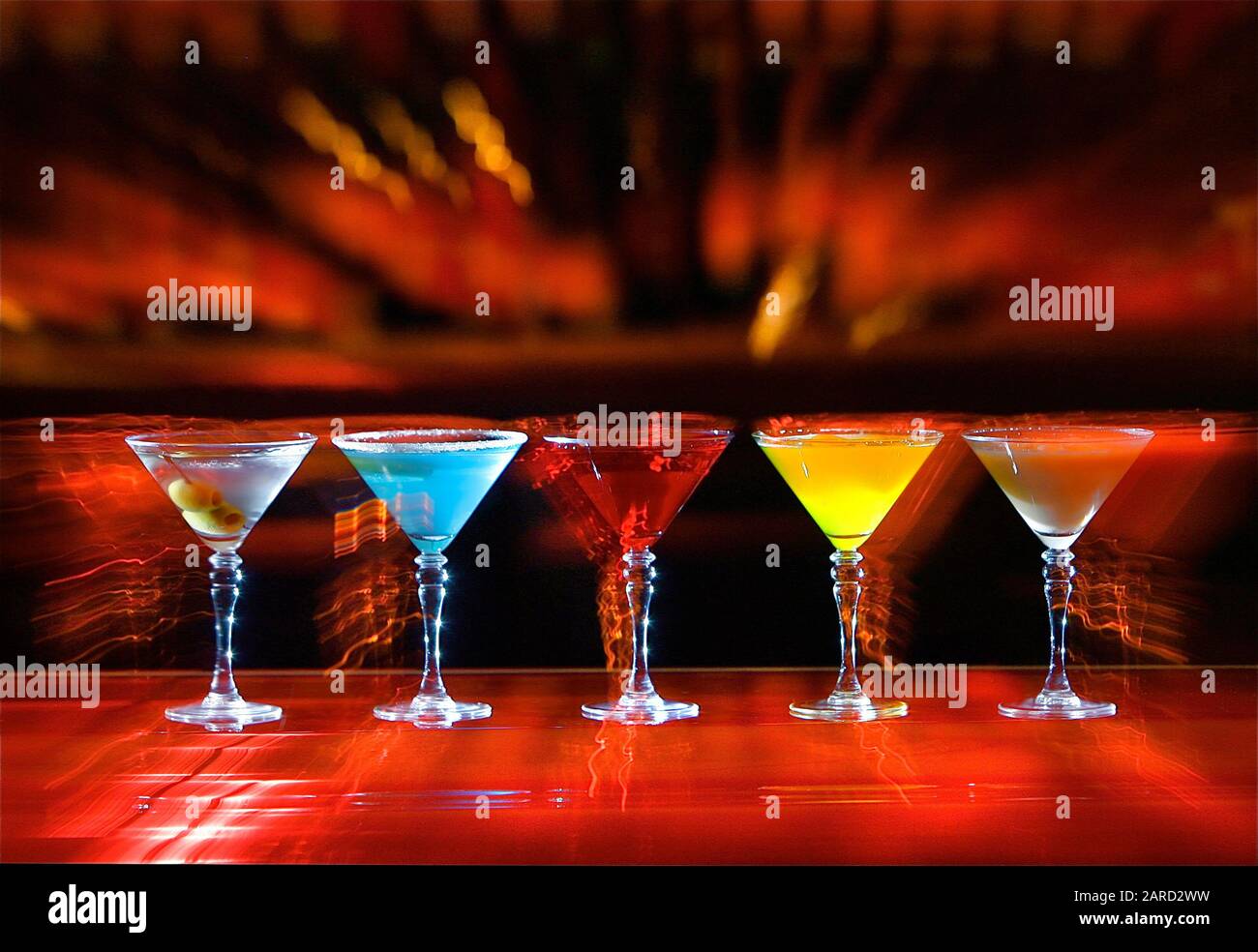 A variety of martinis are lined up in this zoom shot on a bar Stock ...