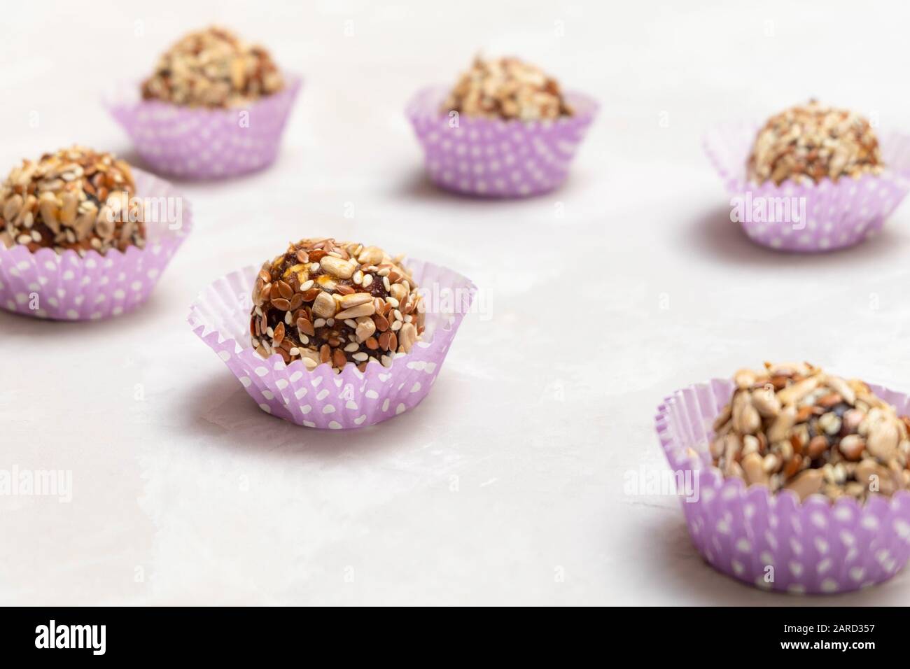 Healthy raw natural candies made of dried fruits, nuts and various ...