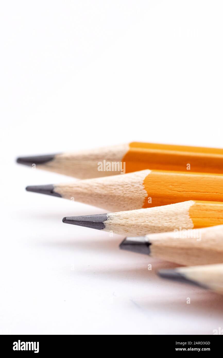 Four pencils on a white background, macro photo Stock Photo - Alamy