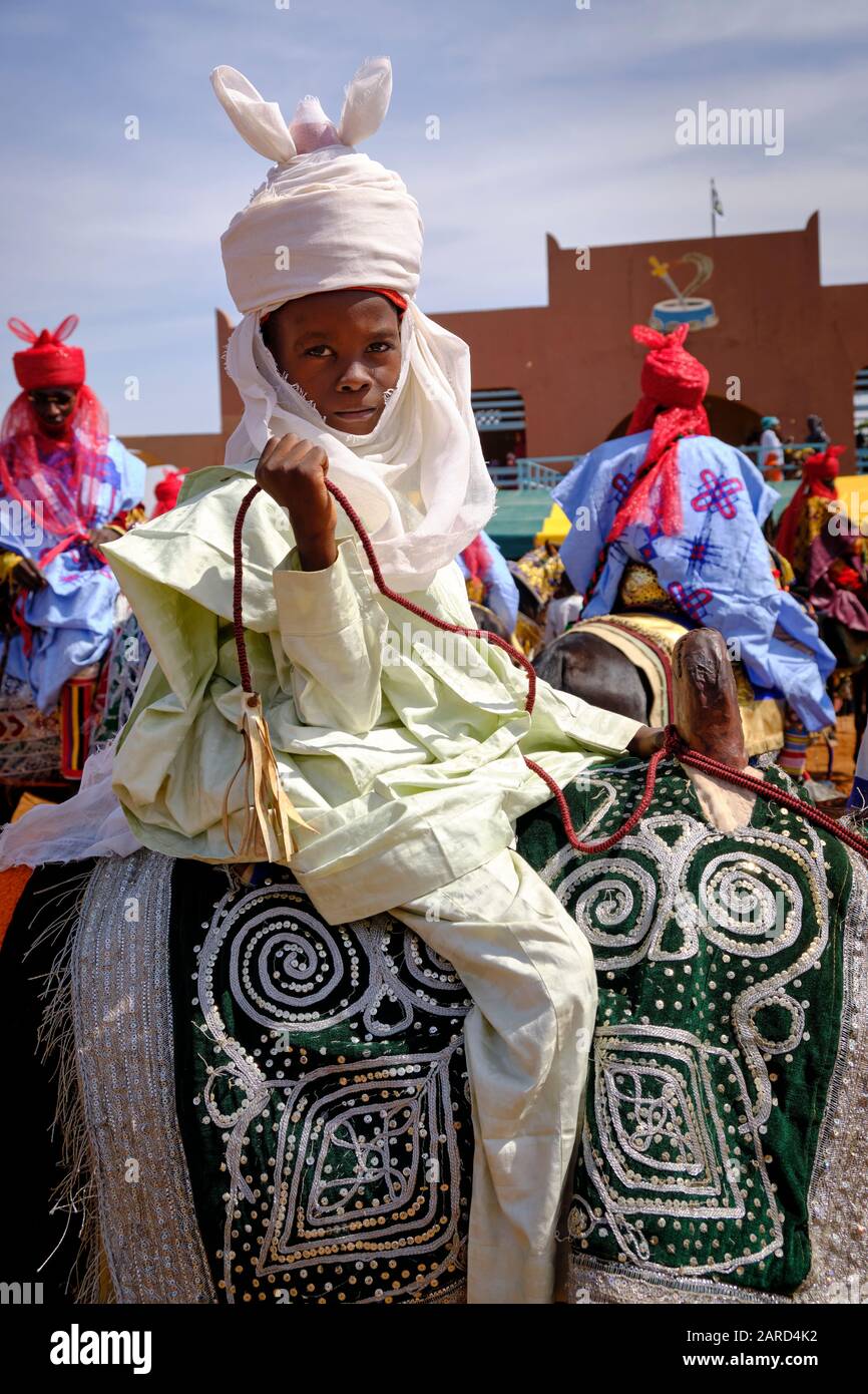 Nobleman rider dressed in a colourful outfit mounting an embellished ...