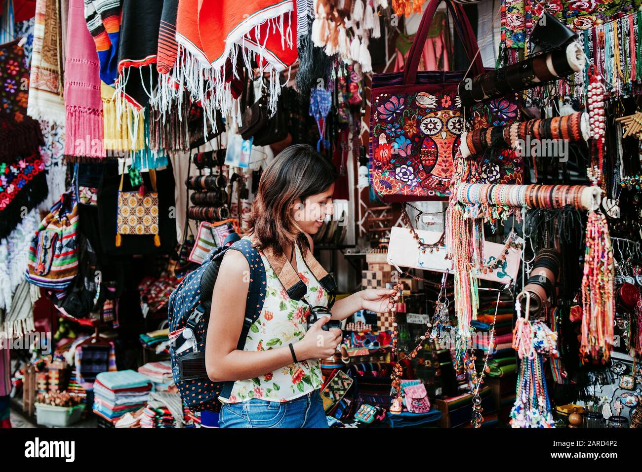 Latin woman backpacker in a Tourist Market in Mexico City, Mexican ...