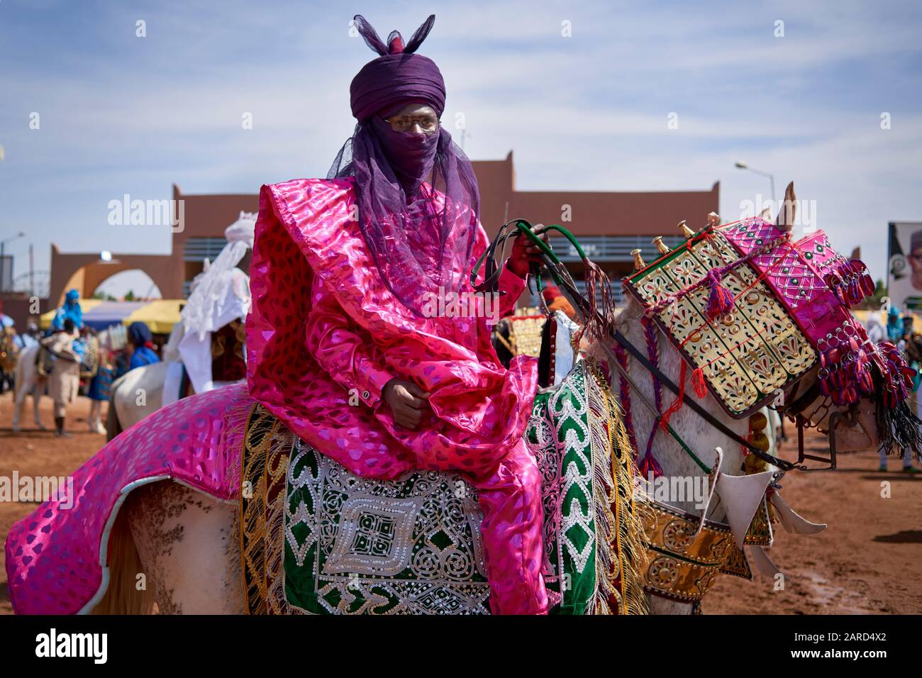 Nobleman rider dressed in a colourful outfit mounting an embellished ...