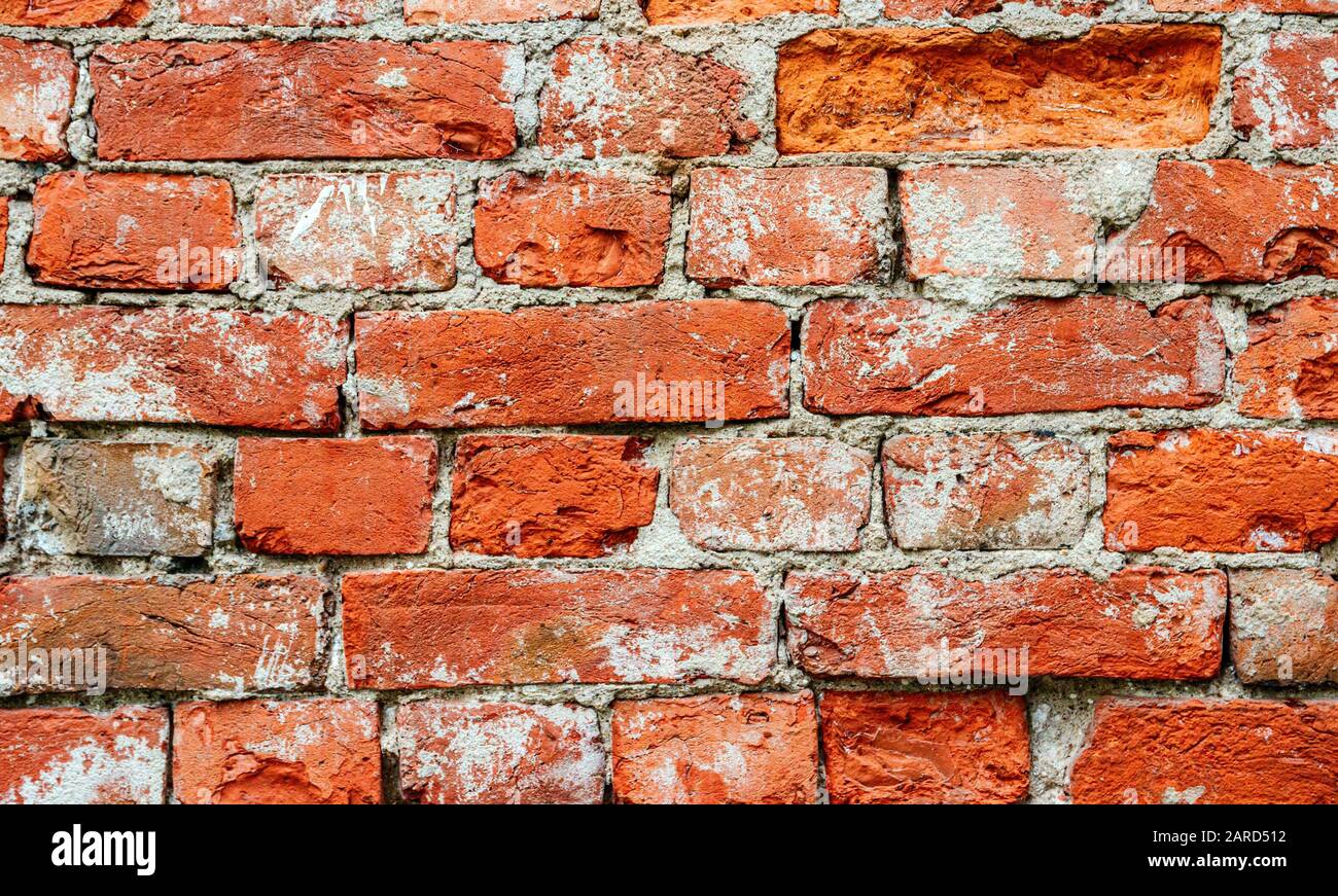 Old, weathered rough brick wall with red bricks Stock Photo - Alamy