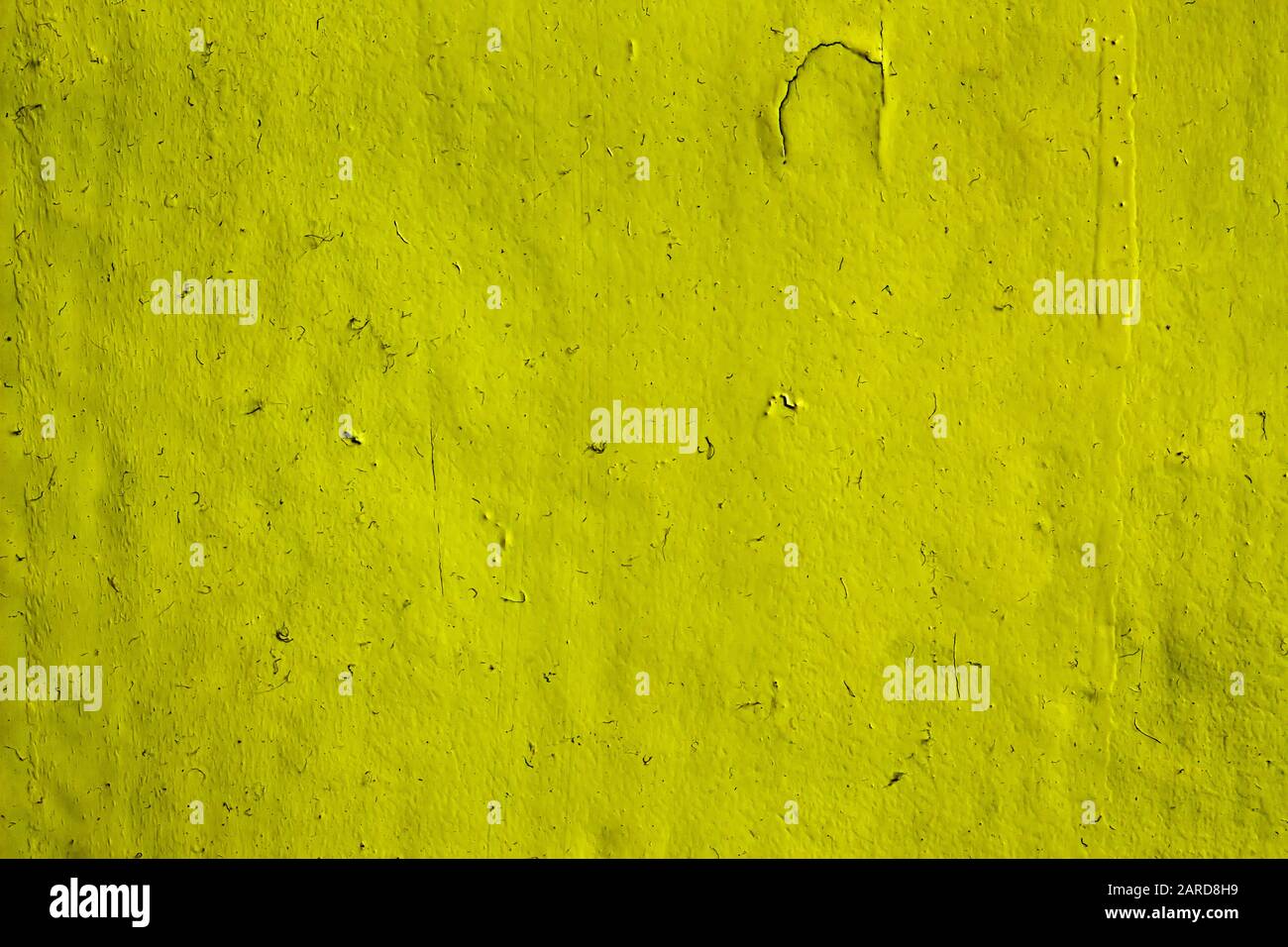 Yellow colored abstract wall background with textures of different ...