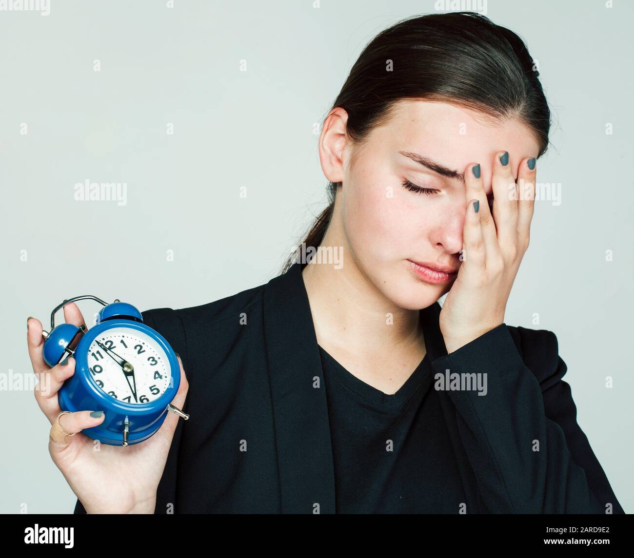 young beauty woman in business style costume waking up for work early ...