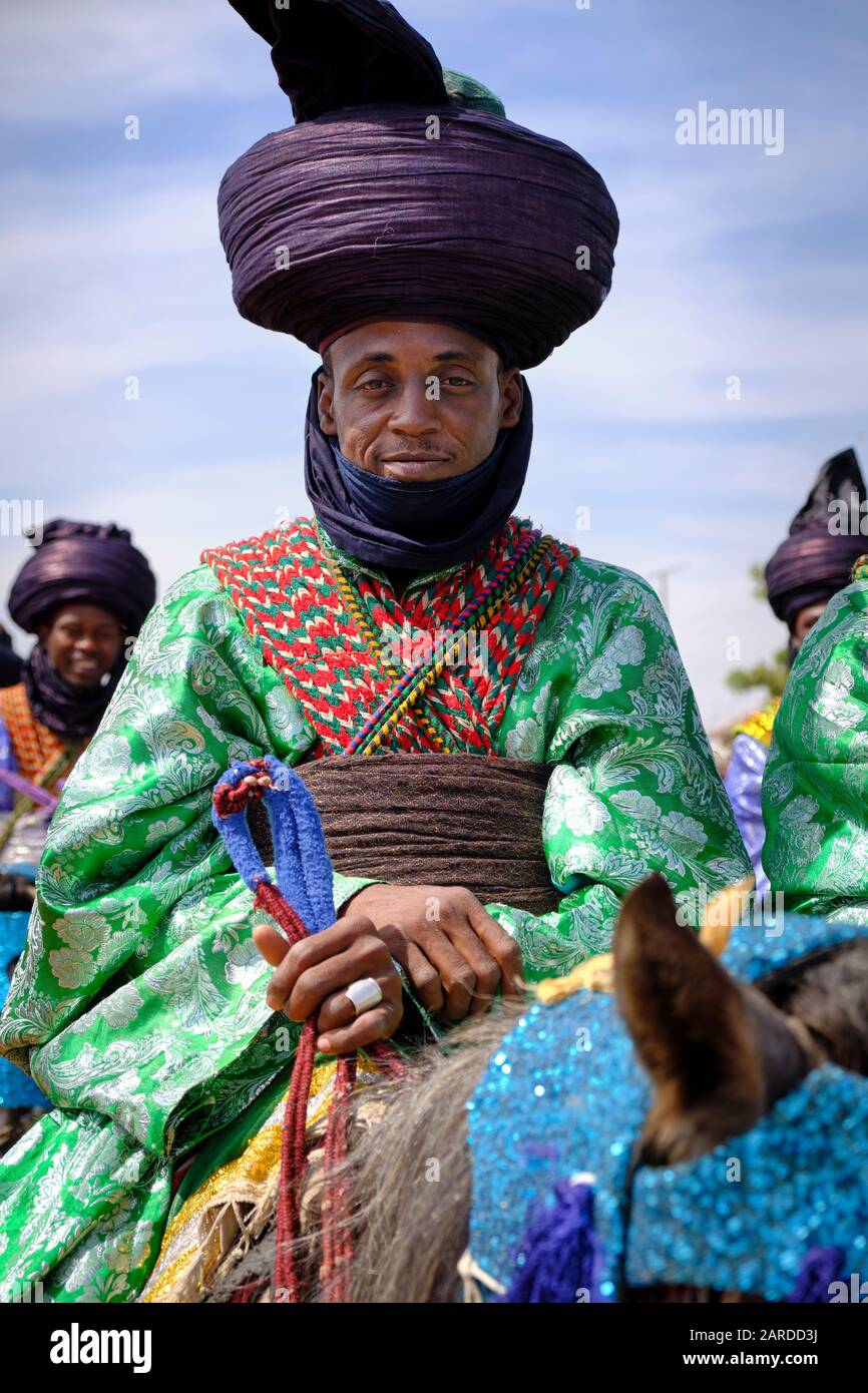 Nobleman rider dressed in a colourful outfit mounting an embellished ...