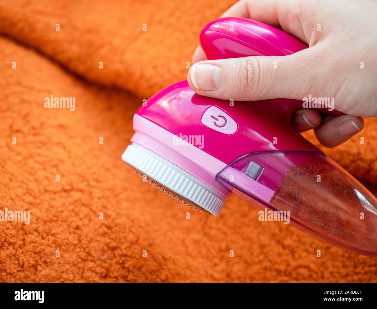 Woman removing clothes hi-res stock photography and images - Alamy